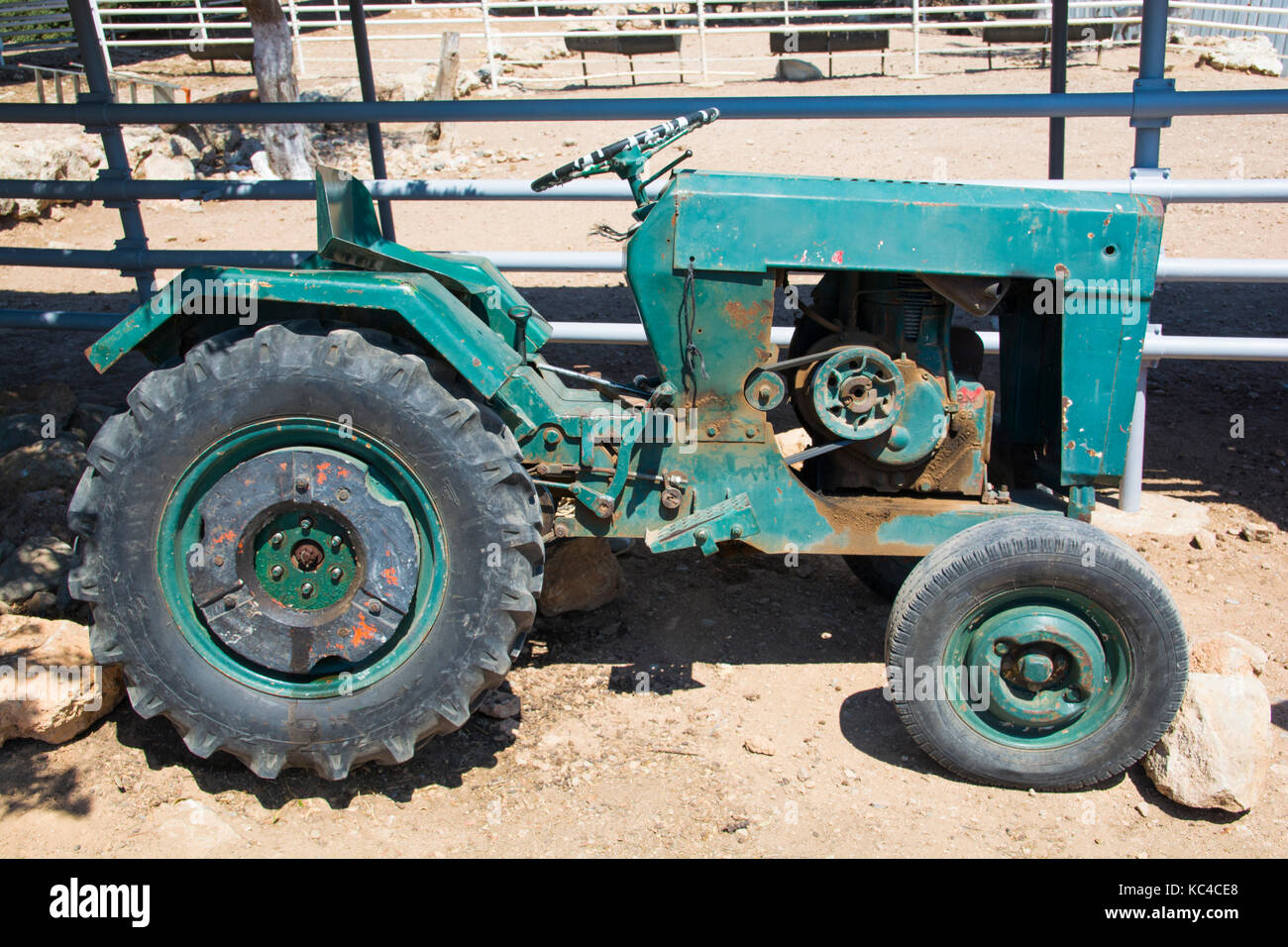 a tired little tractor. still working. agricultural vehicle Stock Photo ...
