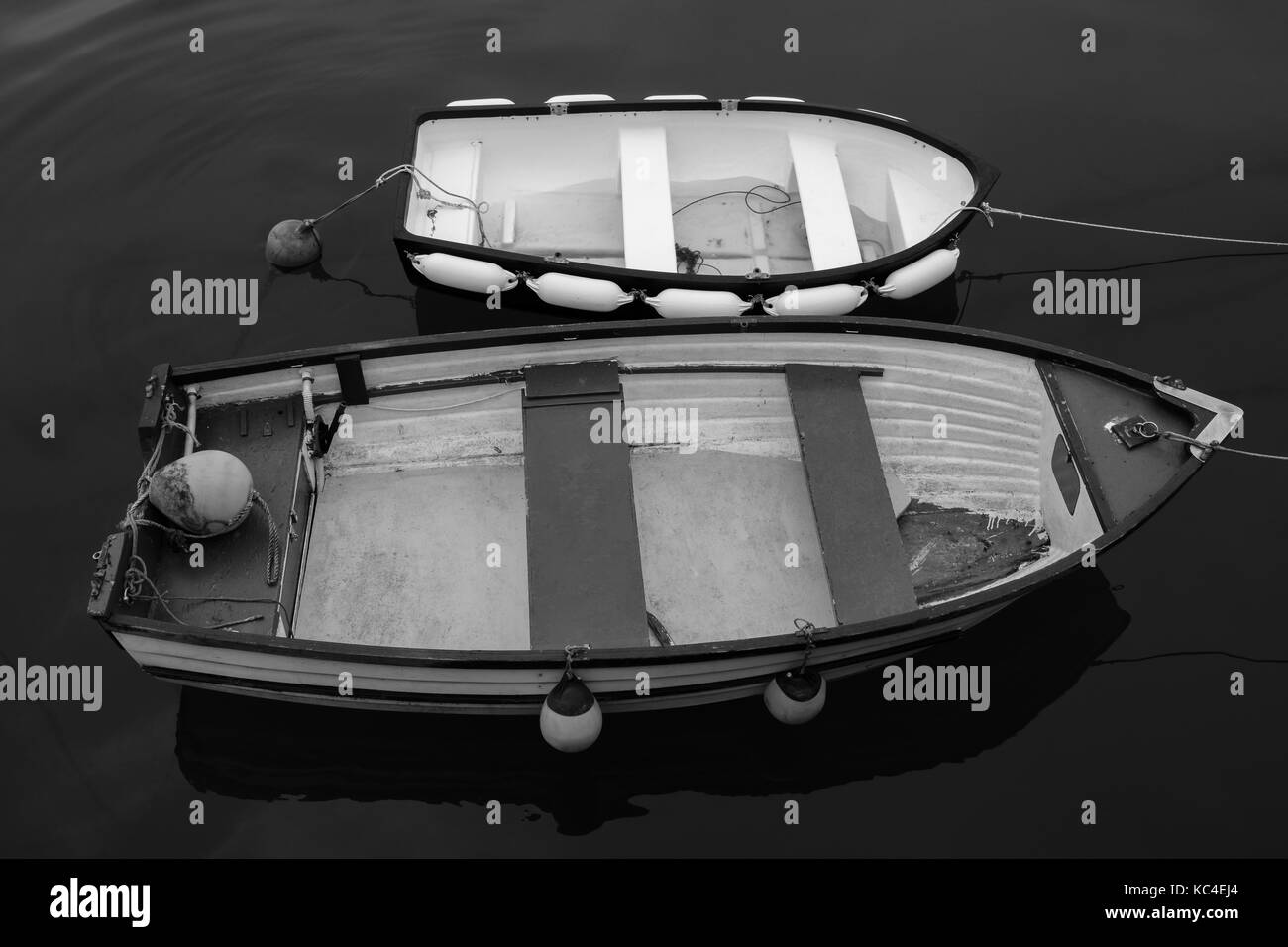 Moored rowing boats in St Ives Harbour in light rain Stock Photo - Alamy