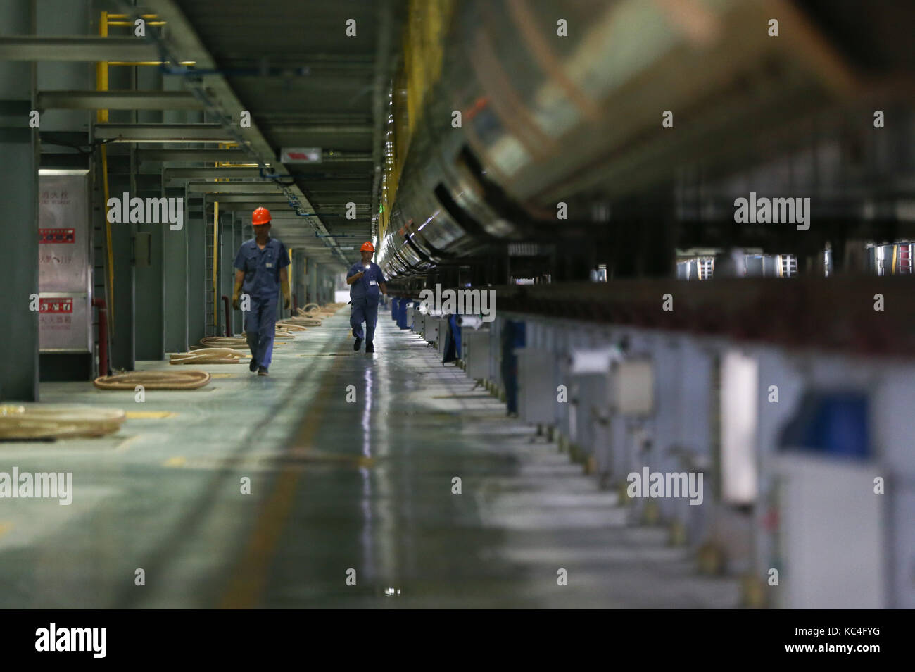 Shanghai, China. 2nd Oct, 2017. Technicians check a Fuxing bullet train ...