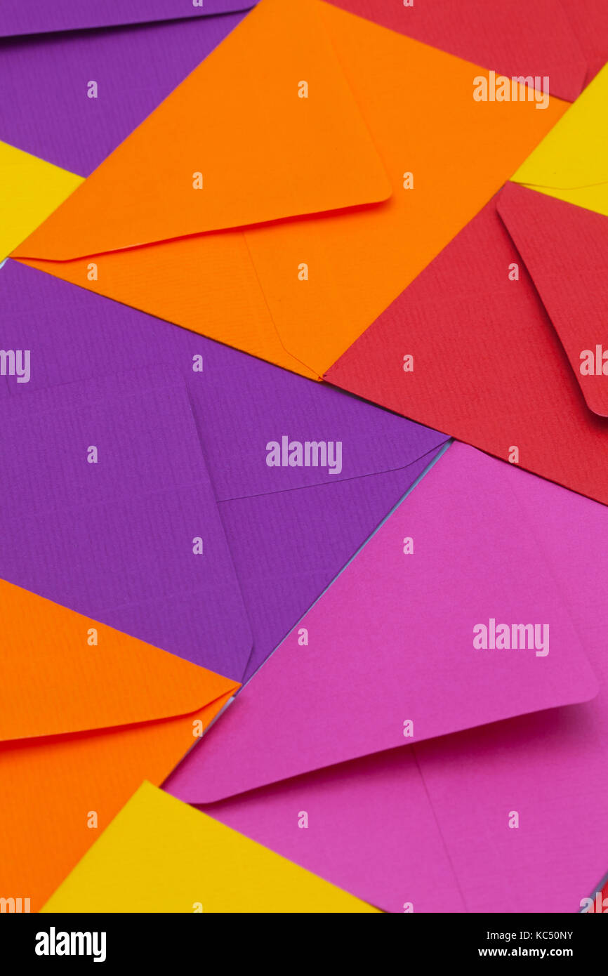 Different colored envelopes on the table Stock Photo - Alamy