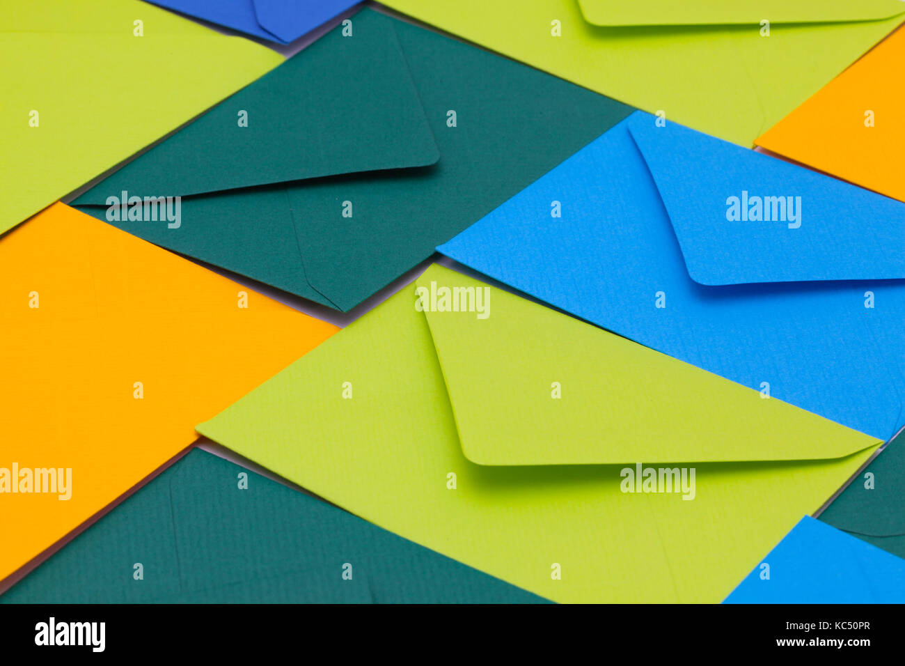 Different colored envelopes on the table Stock Photo - Alamy