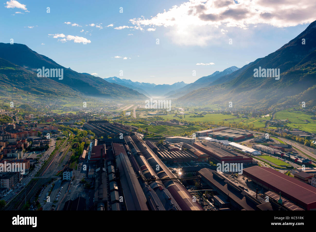 Aerial view of Aosta city, in the foreground Steel Factory,Aosta Valley ...