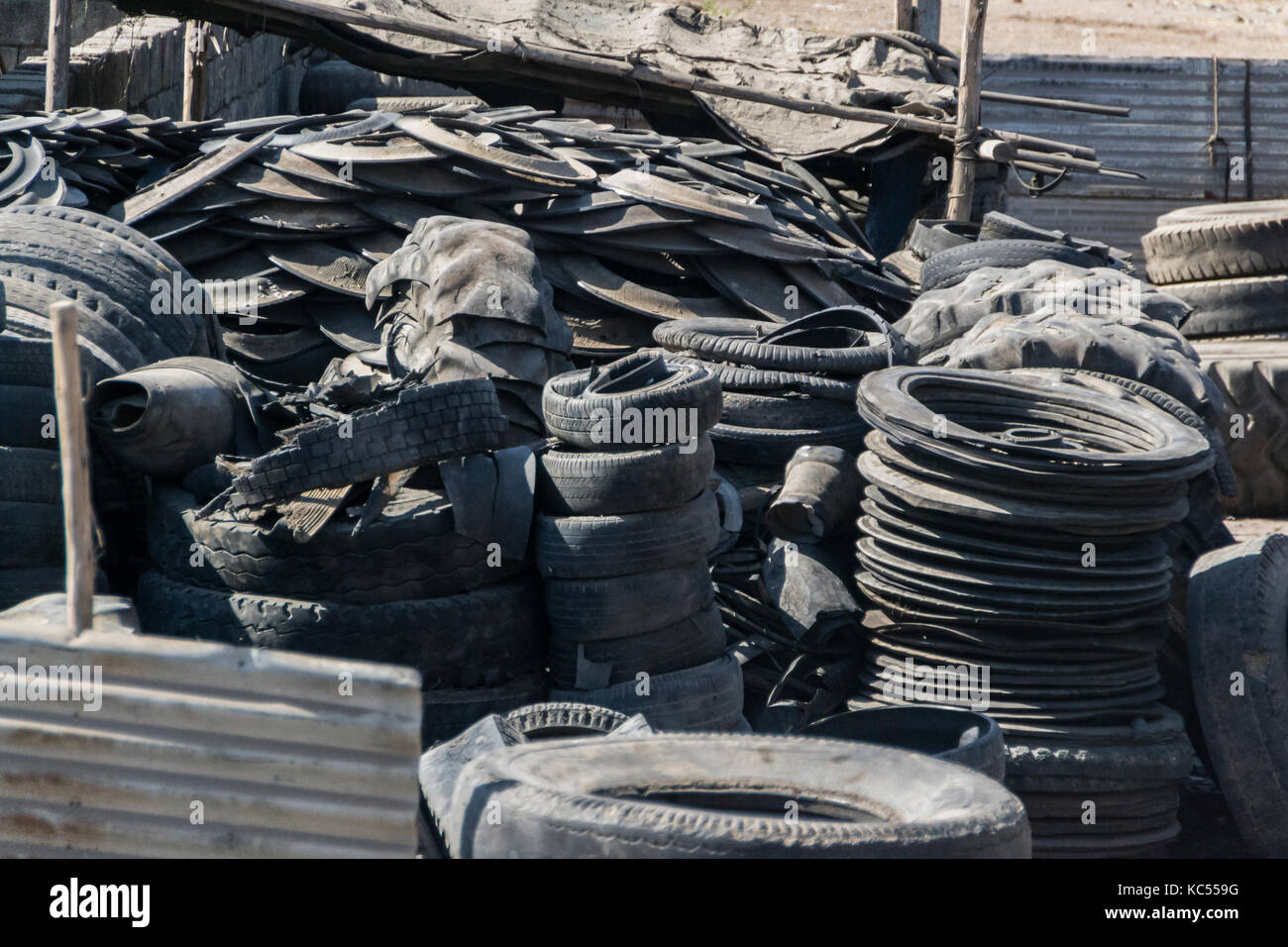 A pile of old rotten rubber tires in a garage in Gujarat, India Stock ...