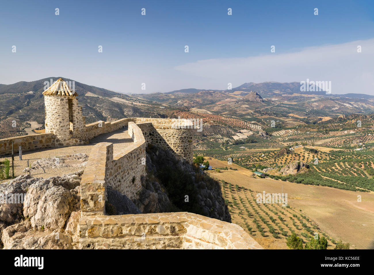View from Moorish castle, hill with olive trees, white village, Olvera ...