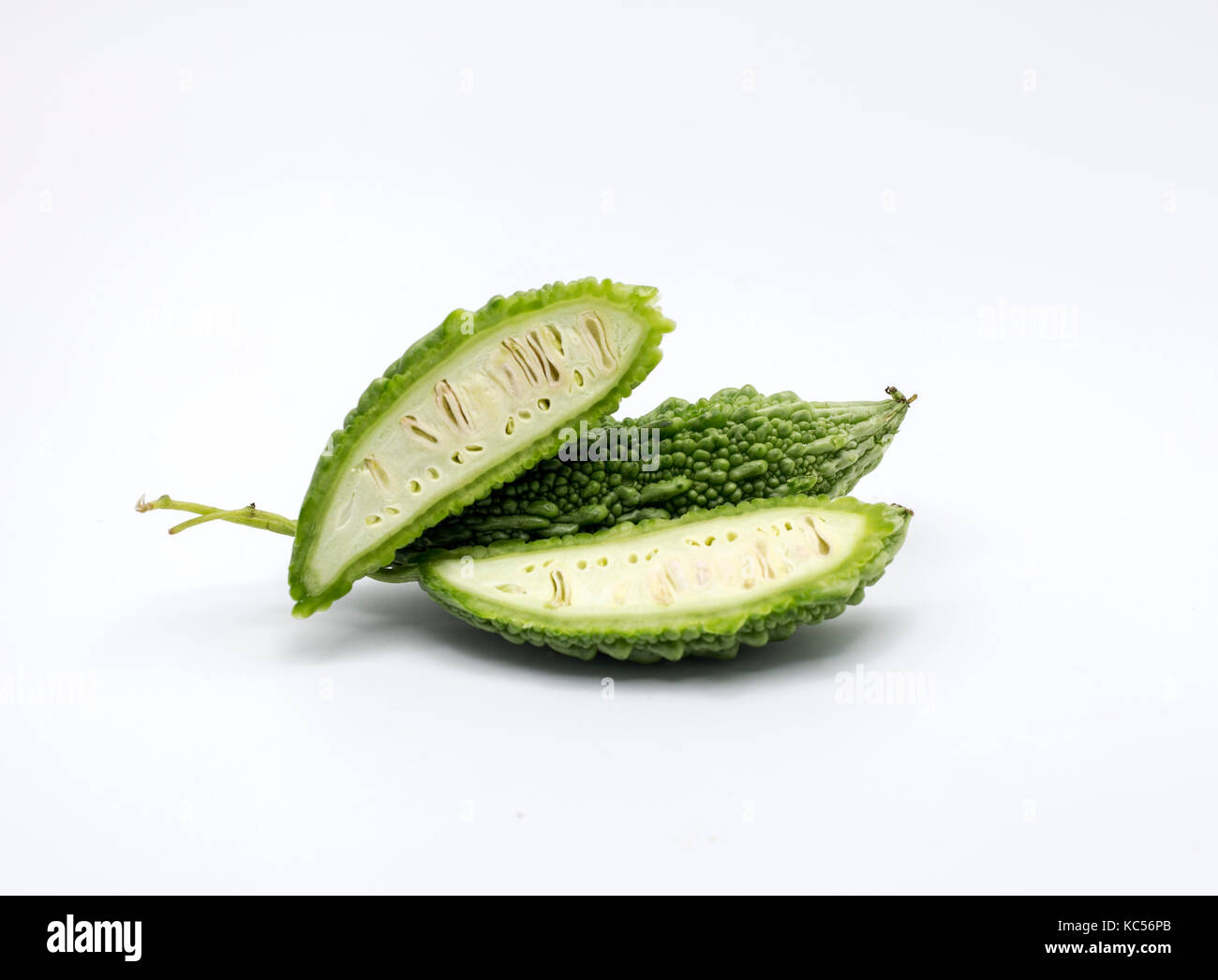 slice bitter gourd disply on white isolate background Stock Photo - Alamy