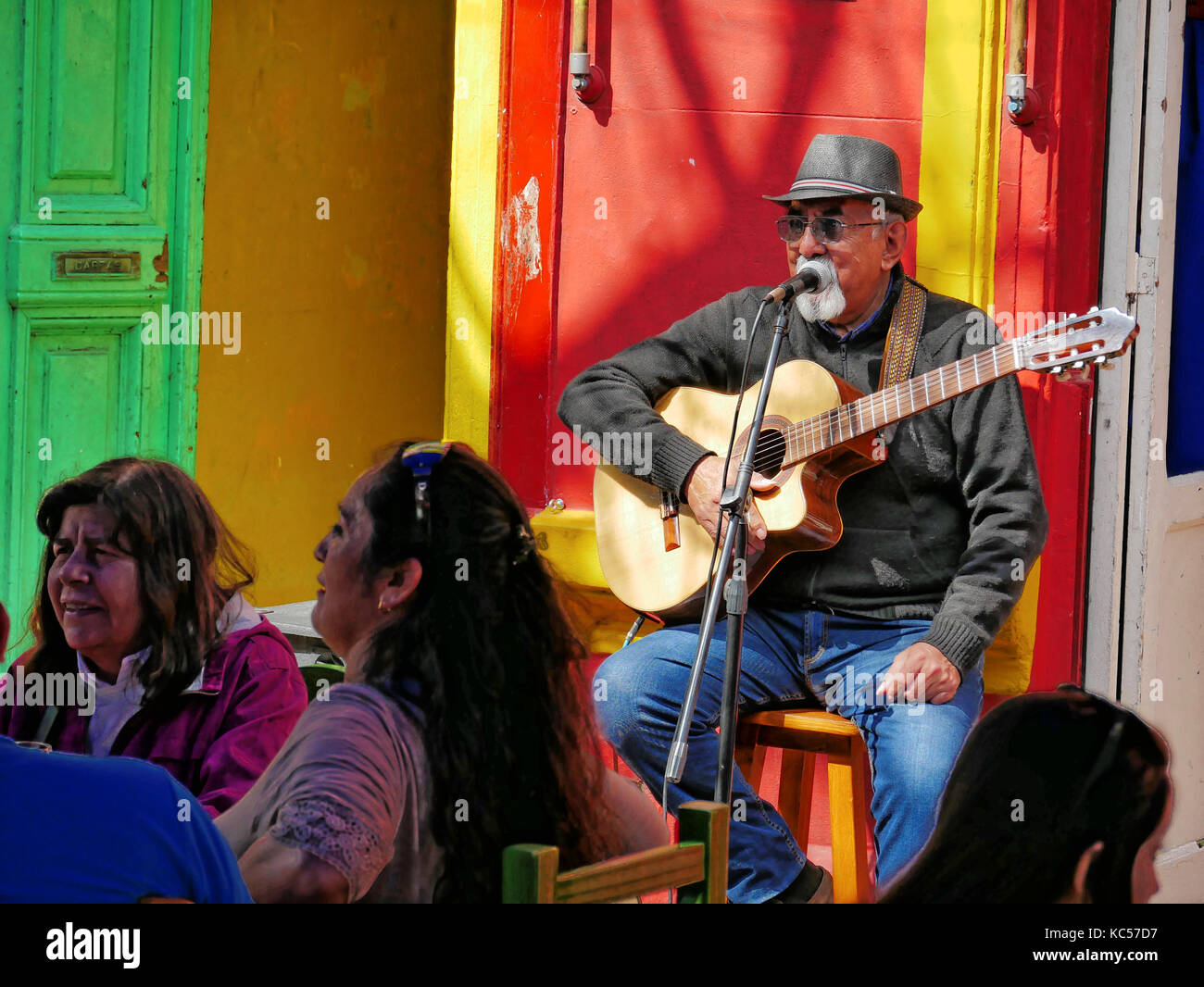 Singer guitarist musician playing to cafe crowd on Caminito, La Boca ...