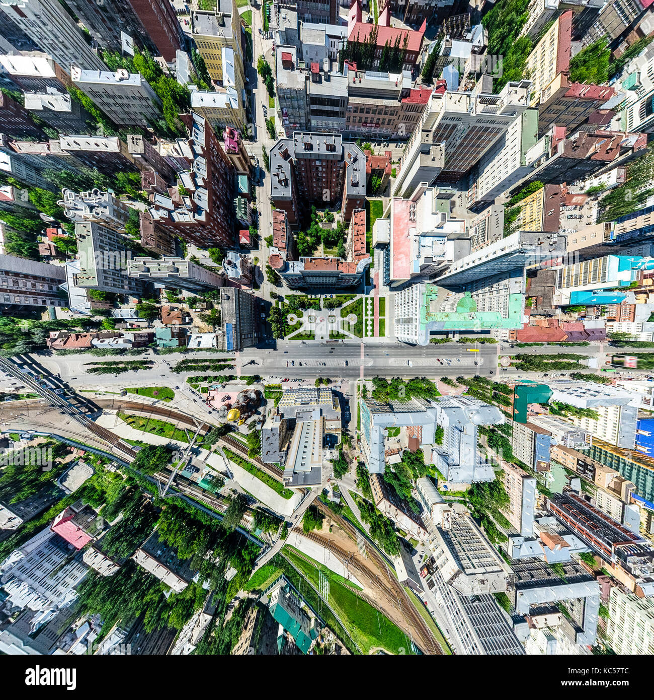 Aerial city view with crossroads and roads, houses, buildings, parks ...
