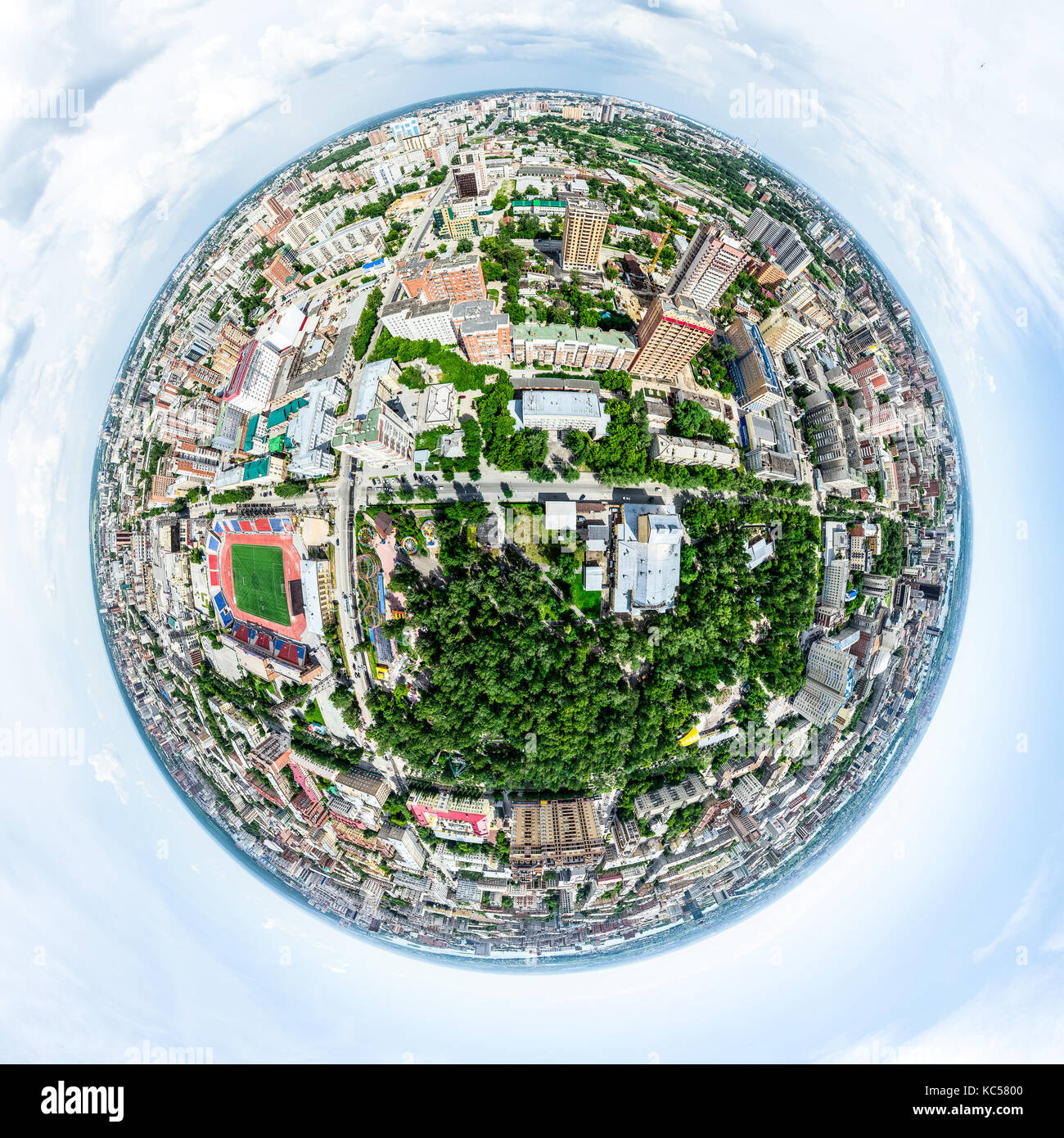 Aerial city view with crossroads and roads, houses, buildings, parks ...