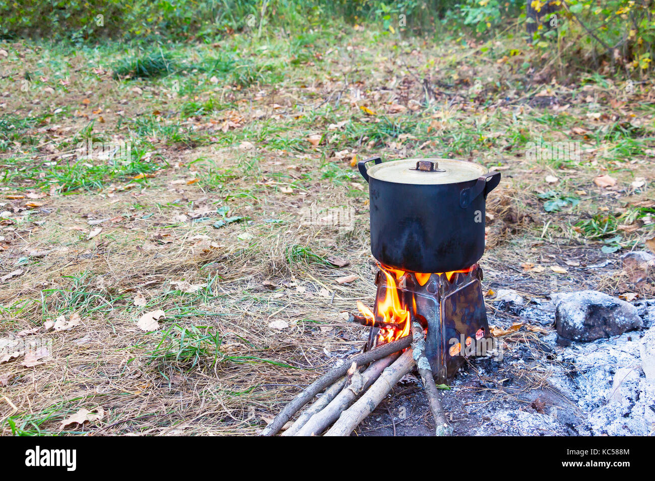 Smoked pot on a camp stove Stock Photo - Alamy