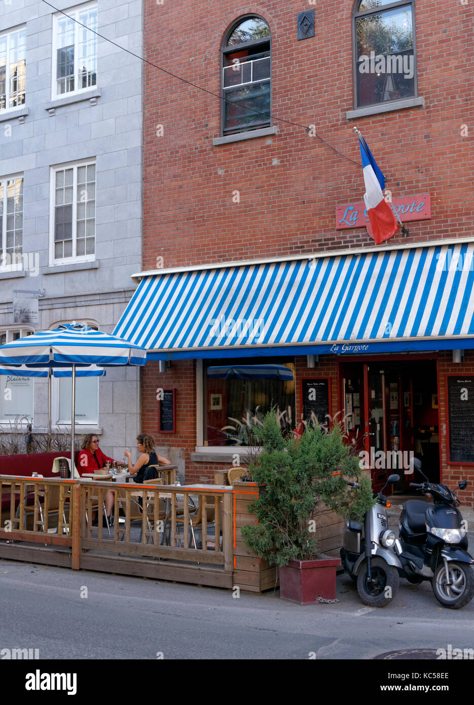 Two women eating and talking at La Gargote French restaurant on Place d ...