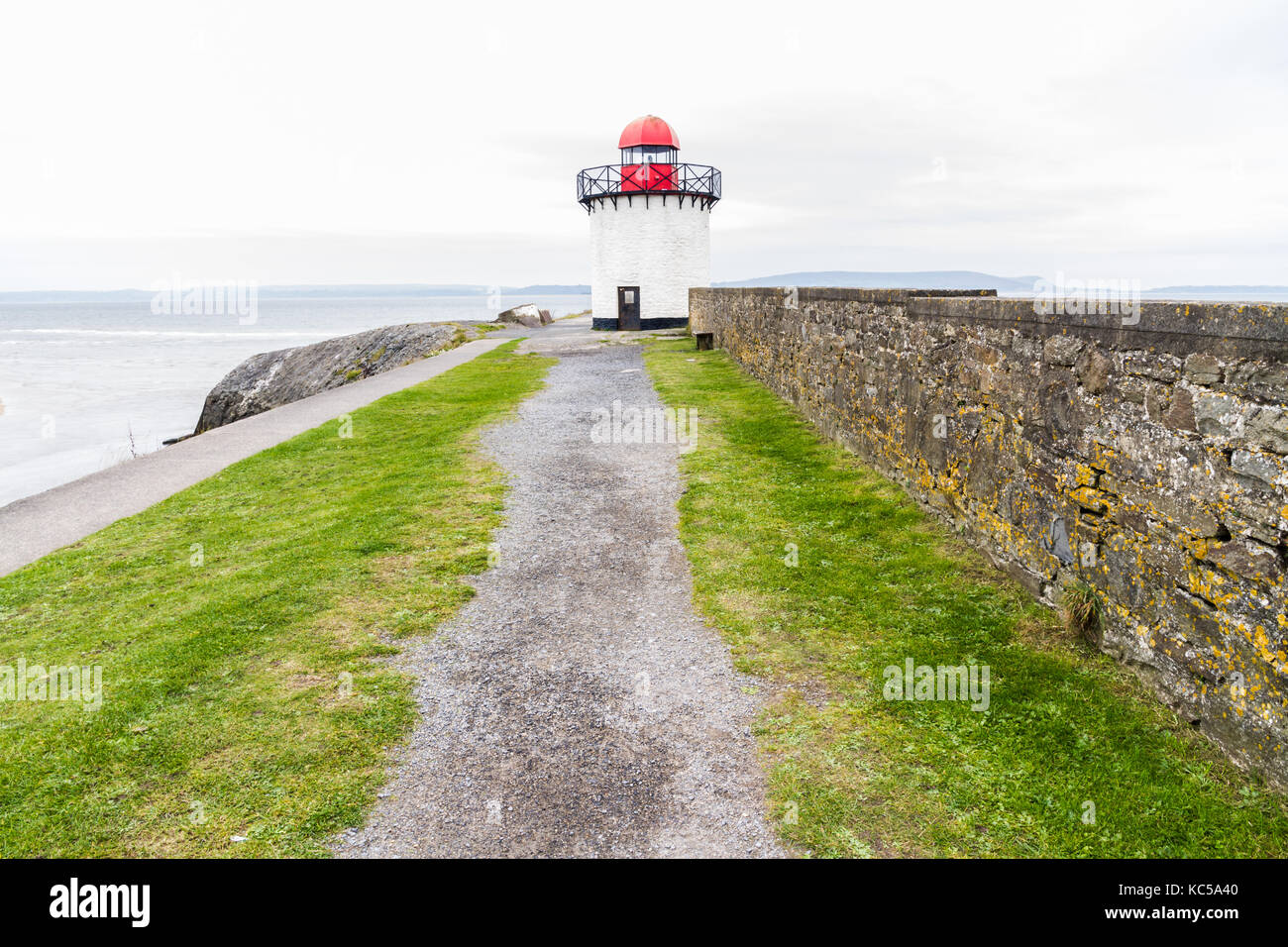 Small white squat white lighthouse with red top. Burry Port, Llanelli ...