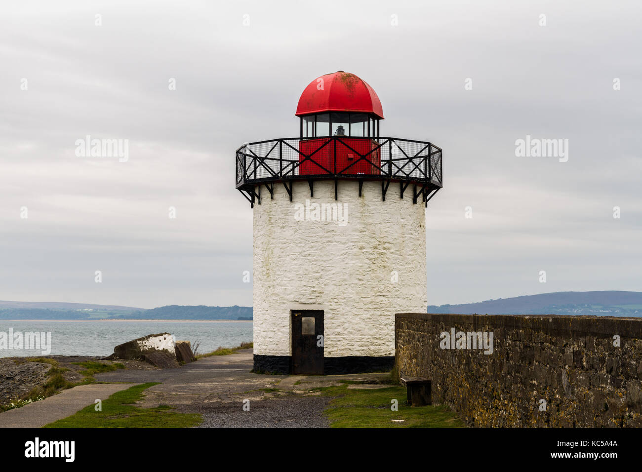Small white squat white lighthouse with red top. Burry Port, Llanelli ...
