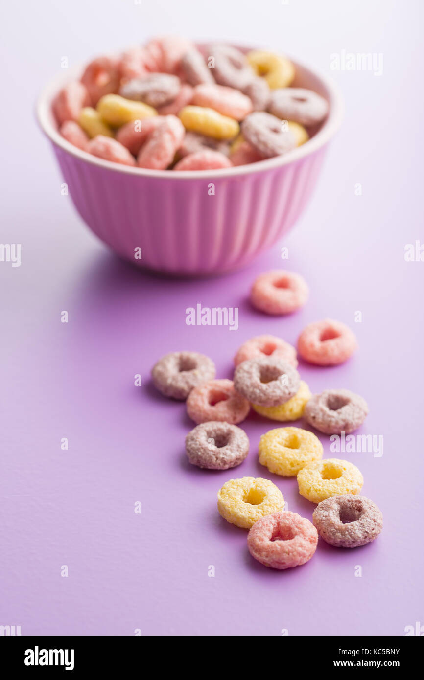 Colorful cereal rings on colorful background Stock Photo - Alamy
