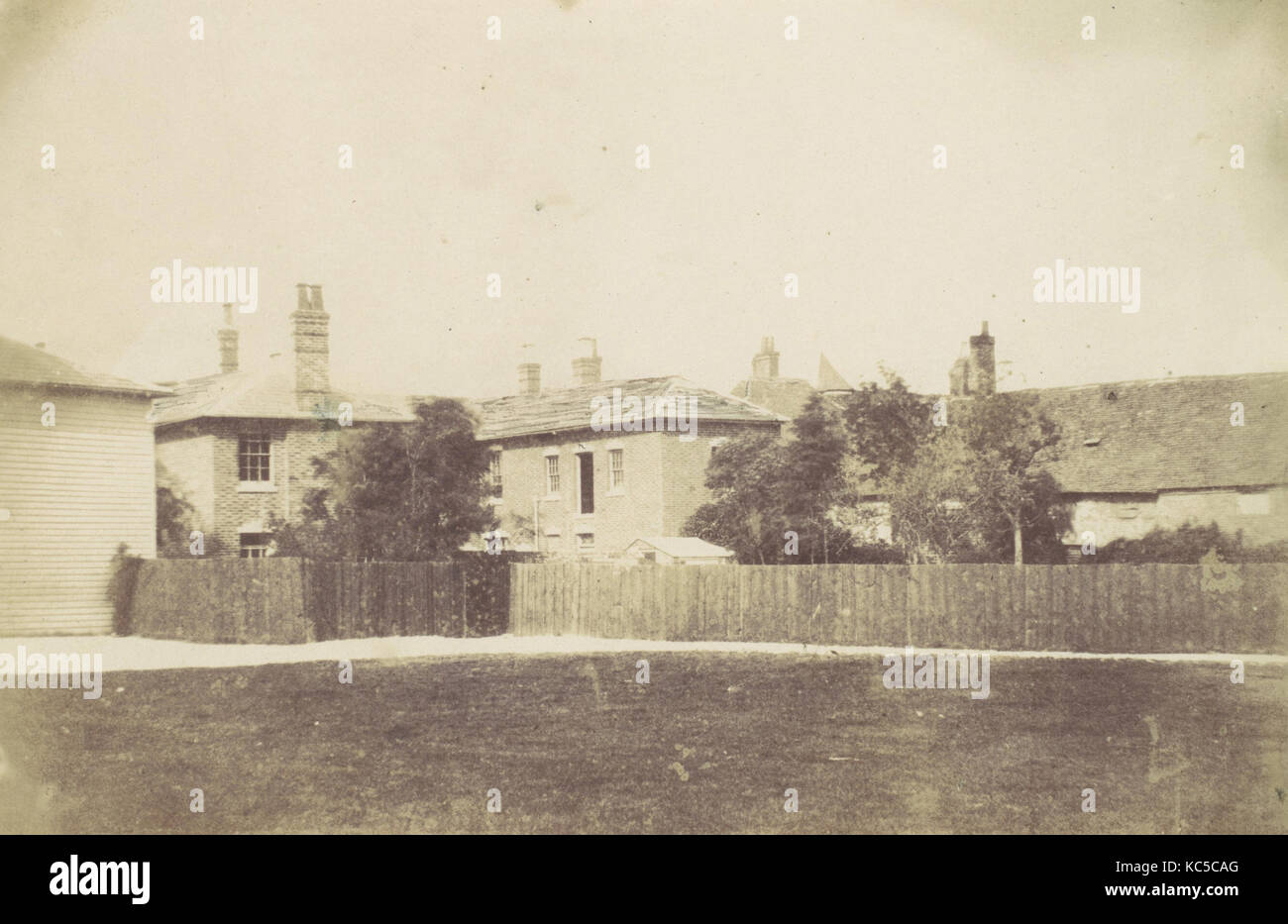 Compound of Buildings Surrounded by Fence, Unknown, 1850s Stock Photo ...
