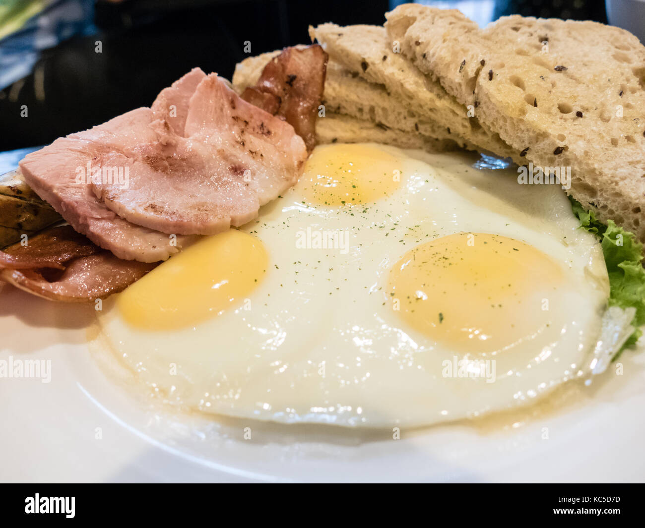 Ham, egg, bacon, German sausage and toast brunch Stock Photo - Alamy
