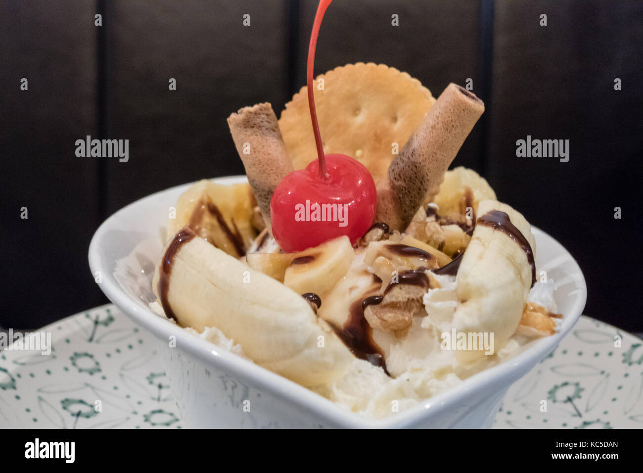 Banana split with cherry dessert in bowl Stock Photo - Alamy
