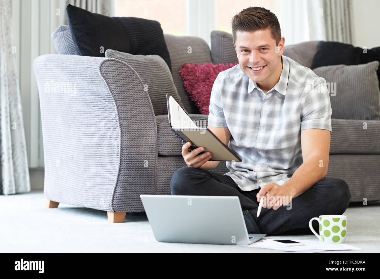 Male Freelance Worker Using Laptop At Home Stock Photo - Alamy