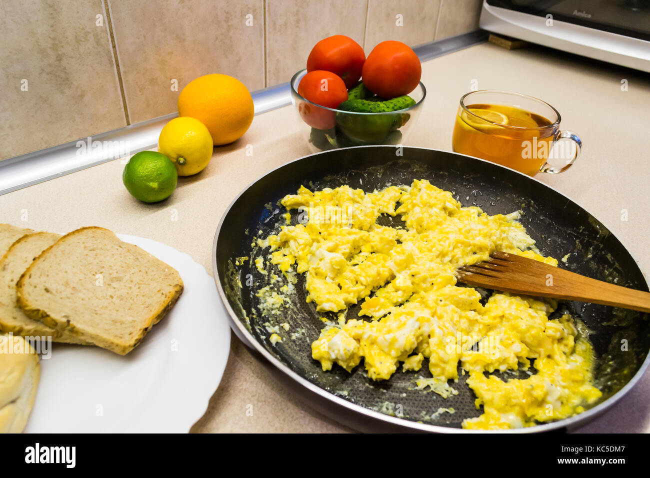Breakfast - scrambled eggs with toppings Stock Photo - Alamy