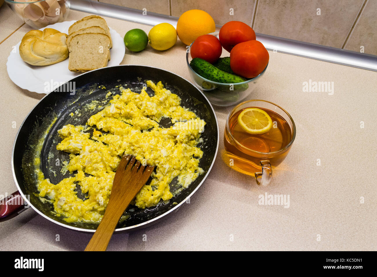 Breakfast - scrambled eggs with toppings Stock Photo - Alamy