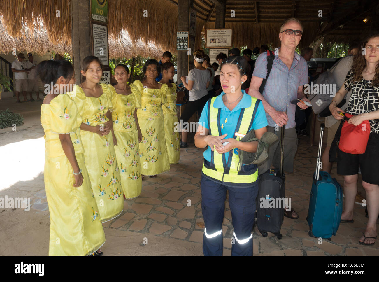 Local filipino staff saying goodbye to Western tourists checking in at ...