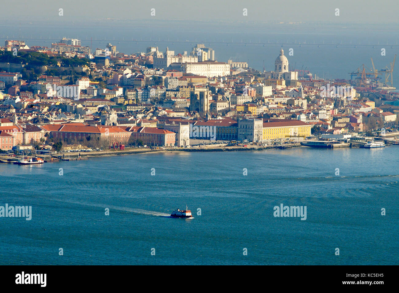 The Tagus river (Tejo river) with a cacilheiro (traditional boat) and ...