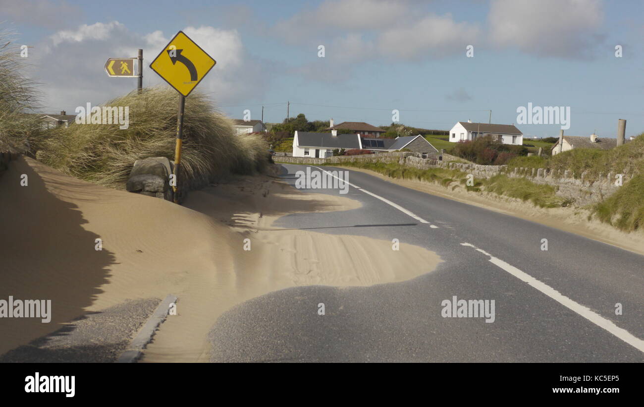 Sand spills over onto the road. The West of Ireland, sand gets blown ...
