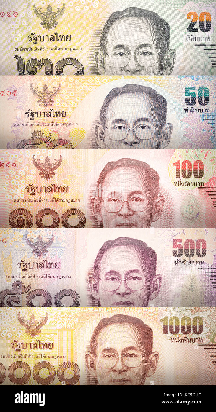 Different money bills stacked over each other forming a money ...