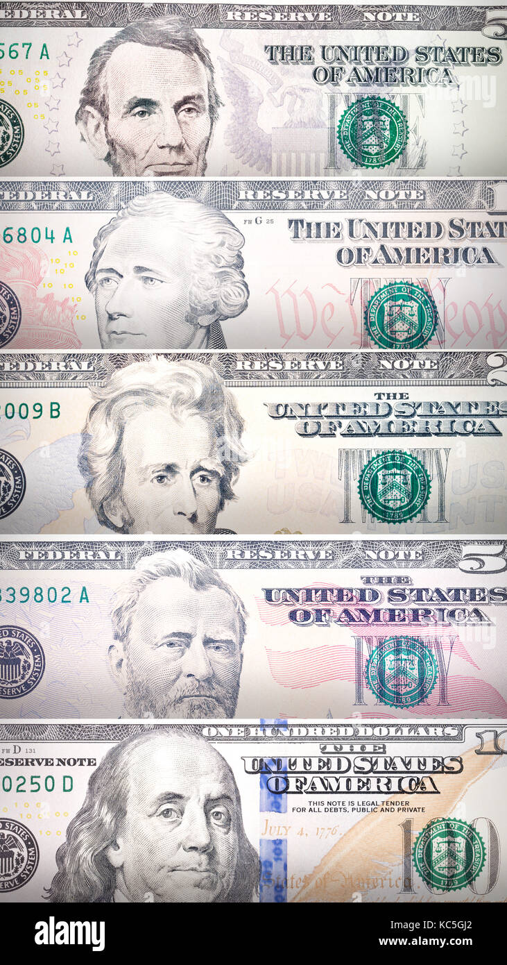 Different money bills stacked over each other forming a money ...