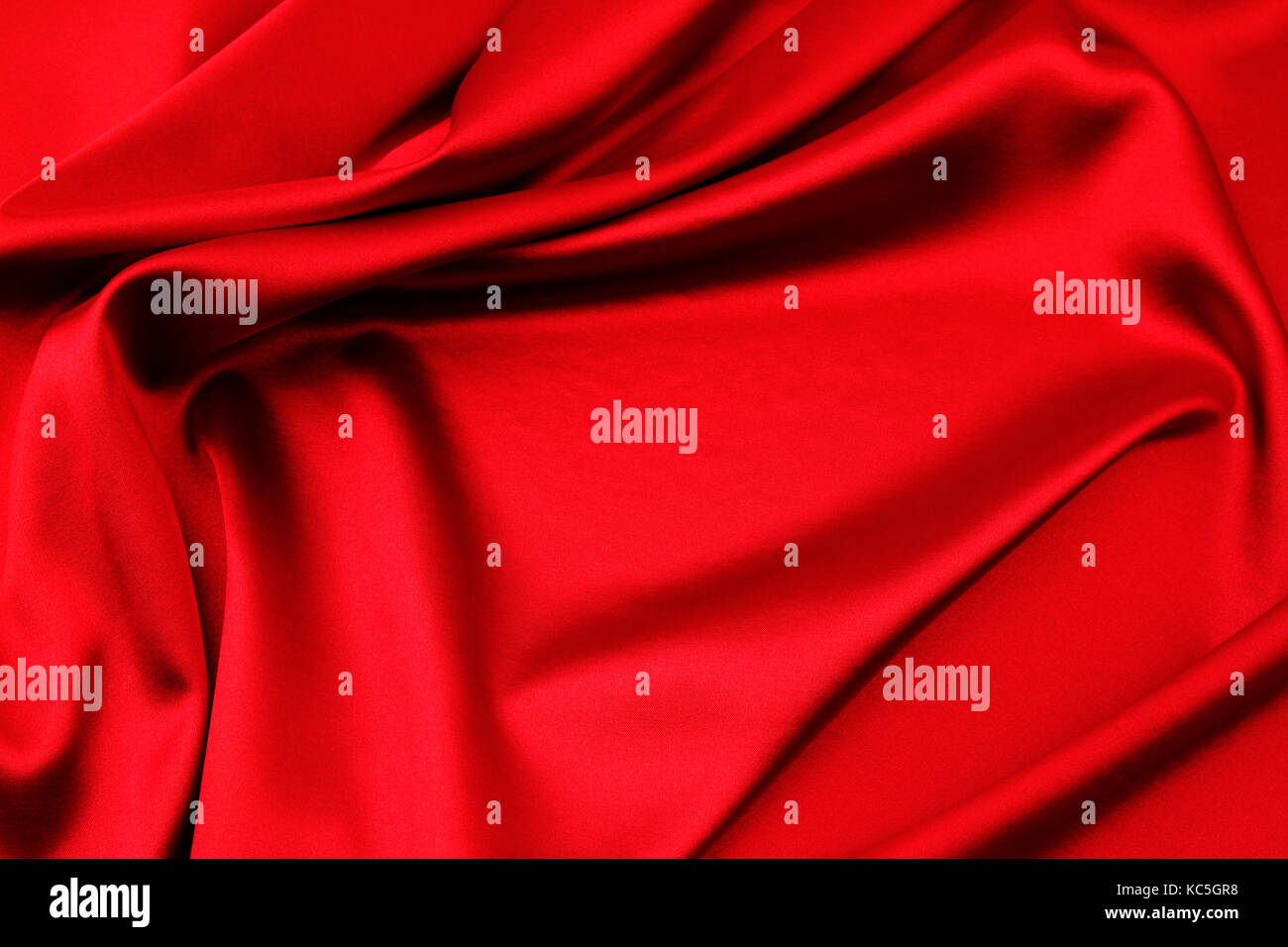 Closeup of ripples in red silk fabric Stock Photo - Alamy