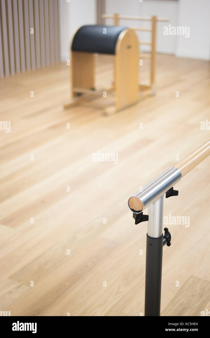 Pilates and ballet dance training stretching bar in gym training ...