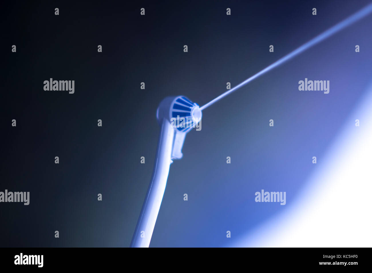 Dental water spray cleaner for interdental hygiene Stock Photo - Alamy