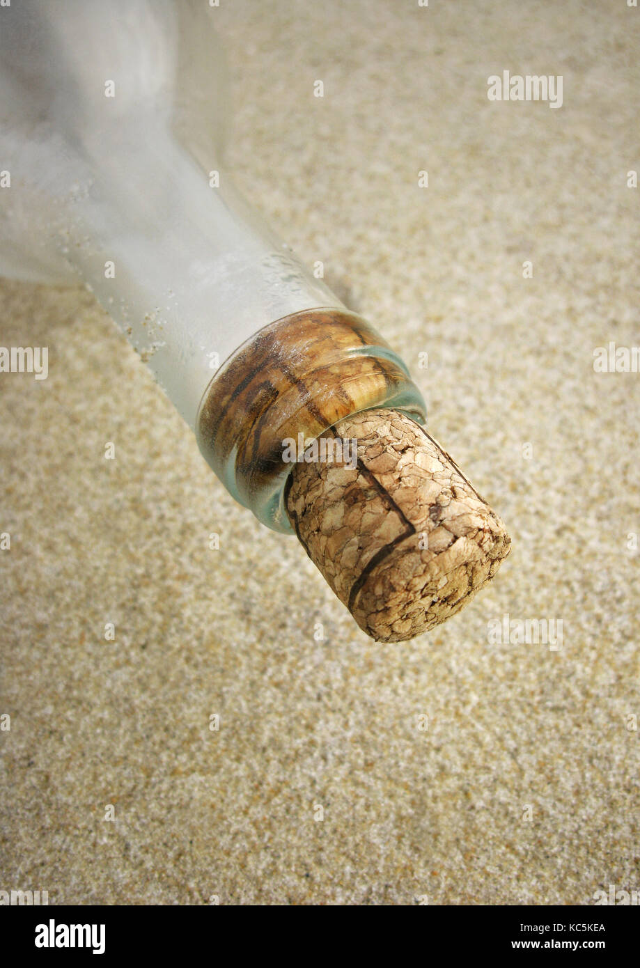 Bottle blocked and abandoned on a beach Stock Photo - Alamy