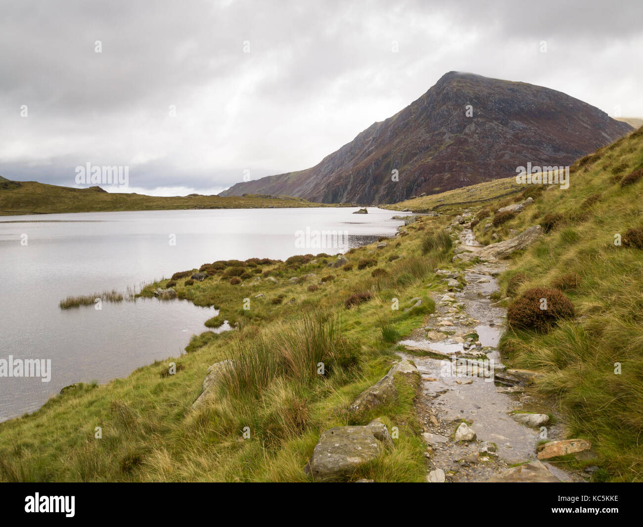 Snowdonia National Park lakeside rock path in mountains at Cwm Idwal ...