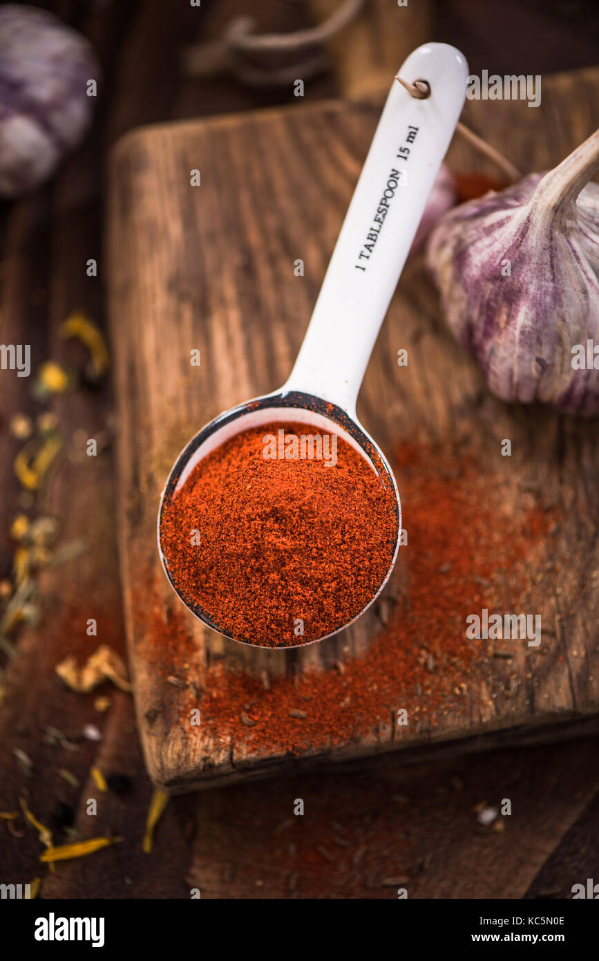 Red paprika powder on spoon Stock Photo - Alamy