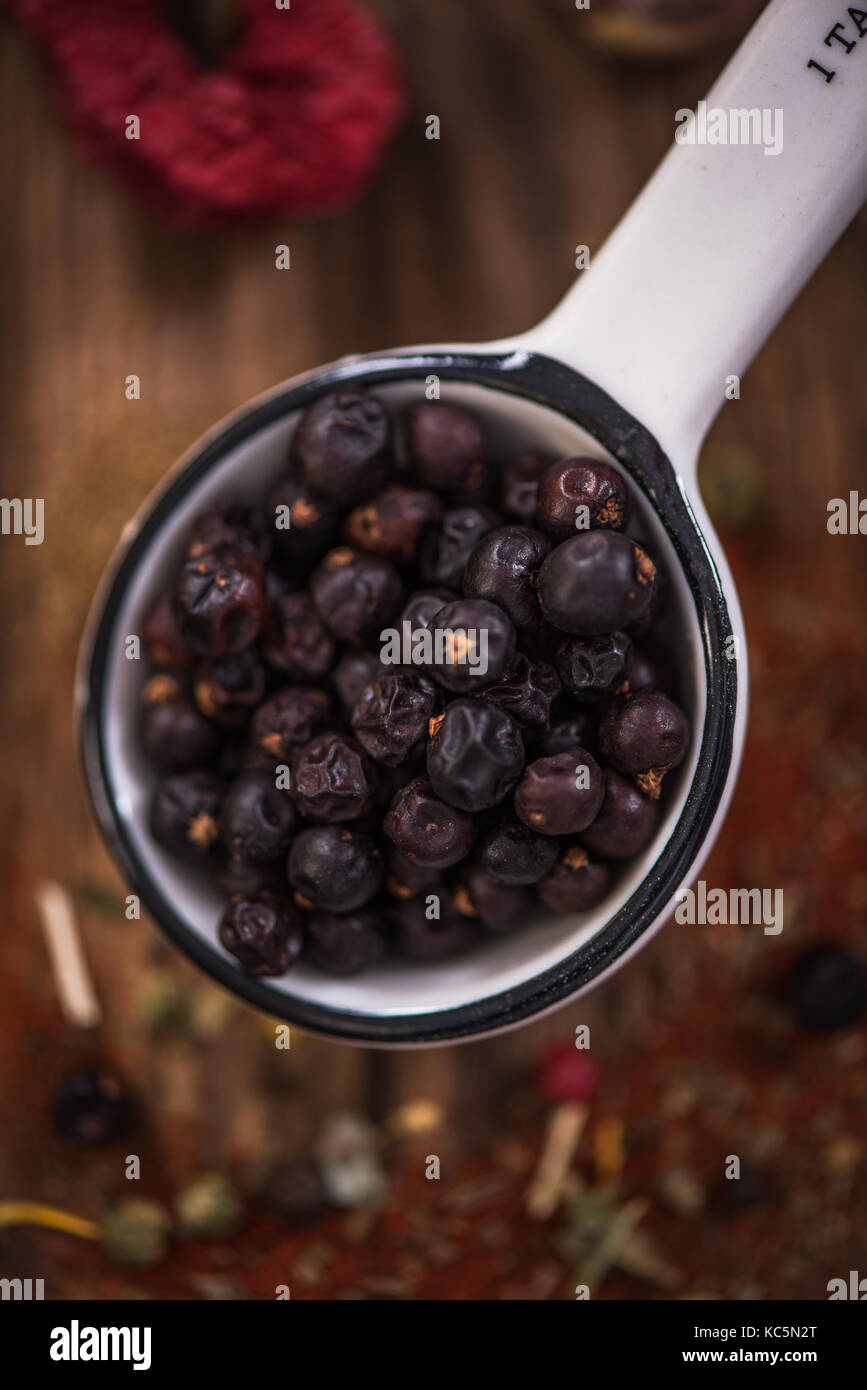 Juniper berry seeds on spoon.Spices and herbs Stock Photo - Alamy