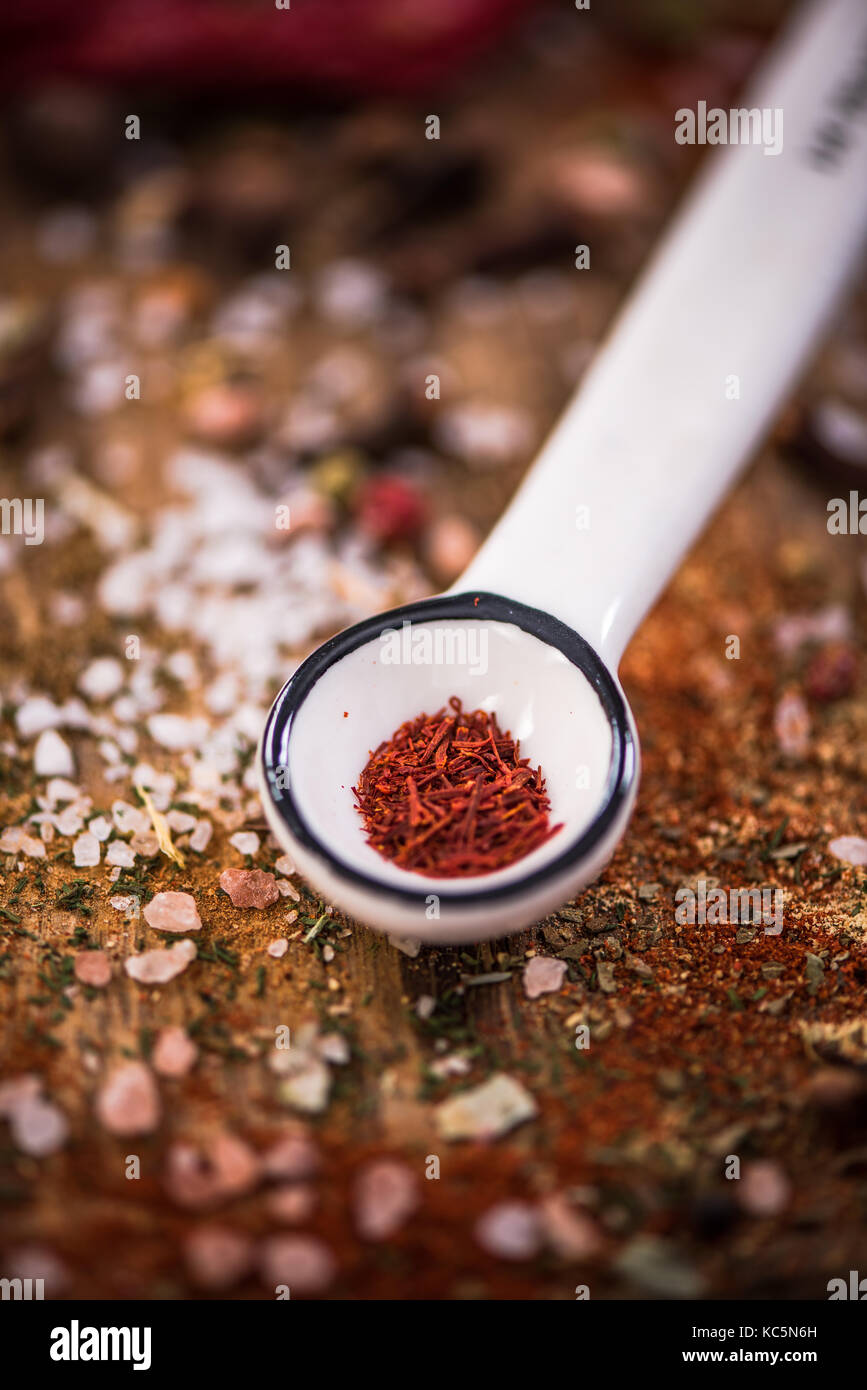 Saffron in ceramic spoon Stock Photo - Alamy