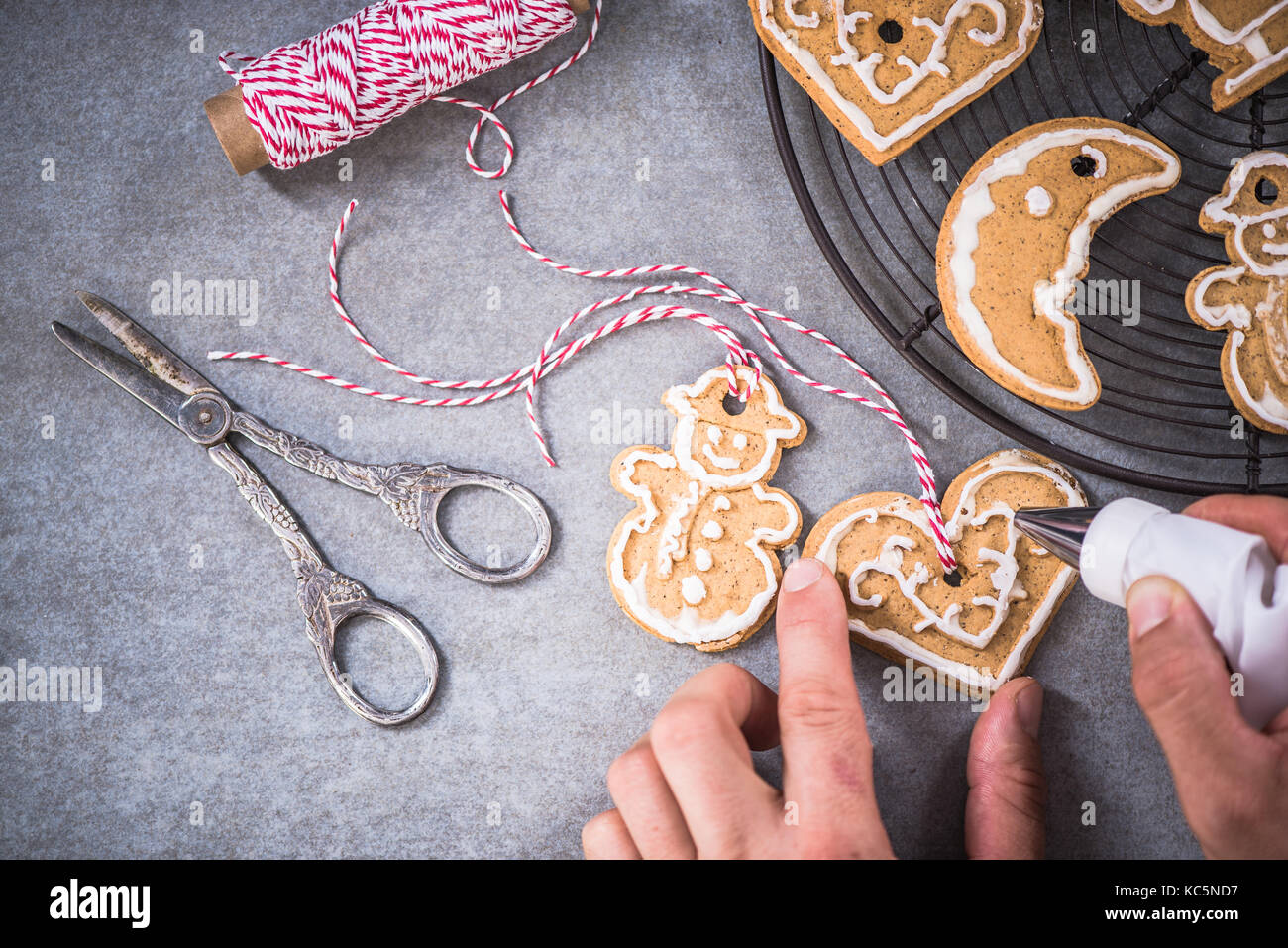 Christmas cookies decorating by hand Stock Photo - Alamy