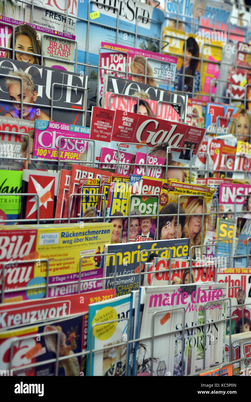A brightly coloured or colourful display of magazines and periodicals ...