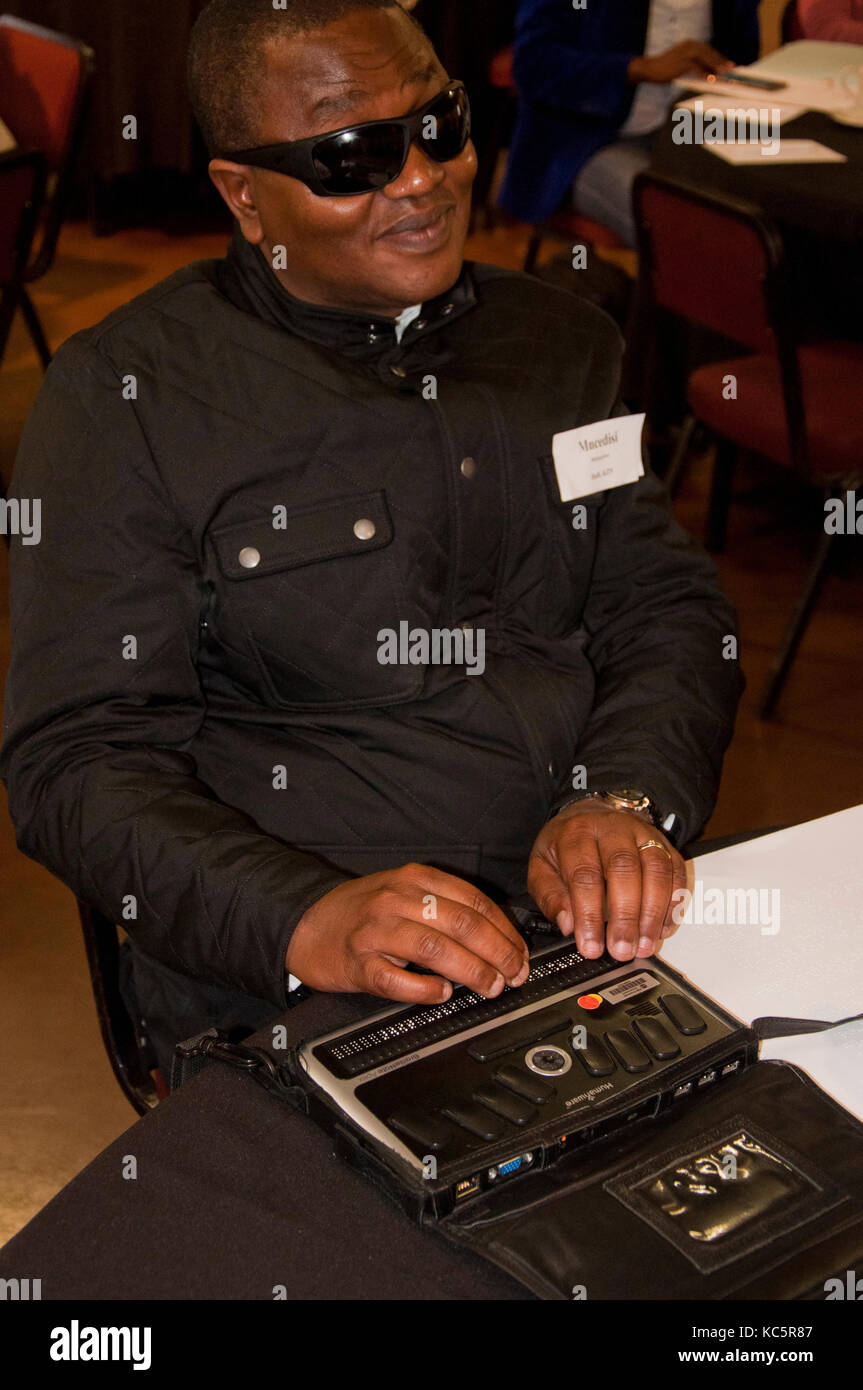 A blind delagate types on a braille device at a workshop. CREATE CBR ...