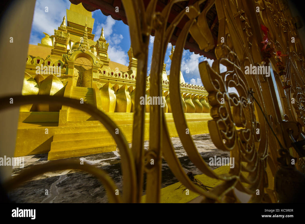 Golden temple gate at Pha That Luang, a Buddhist pagoda in Vientiane ...