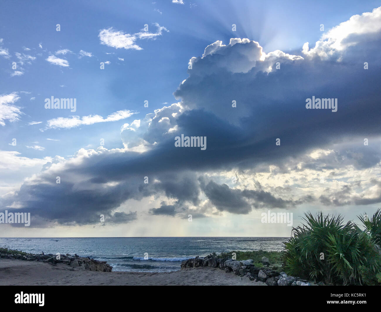 Clouds over beach and sea in Mexico Stock Photo - Alamy
