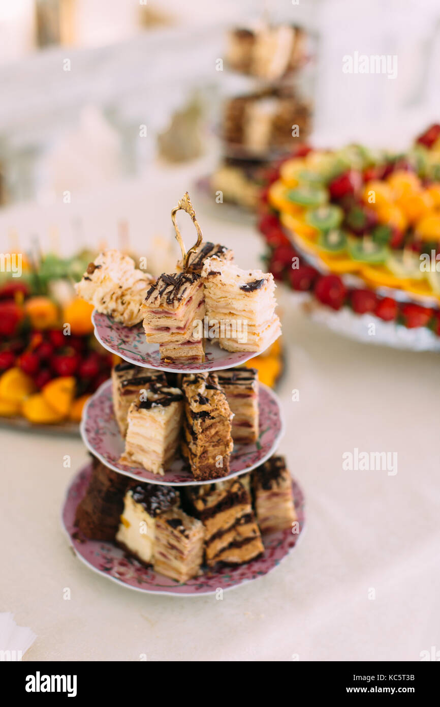 Vertical view of the tasty different cakes on the dessert stand Stock ...