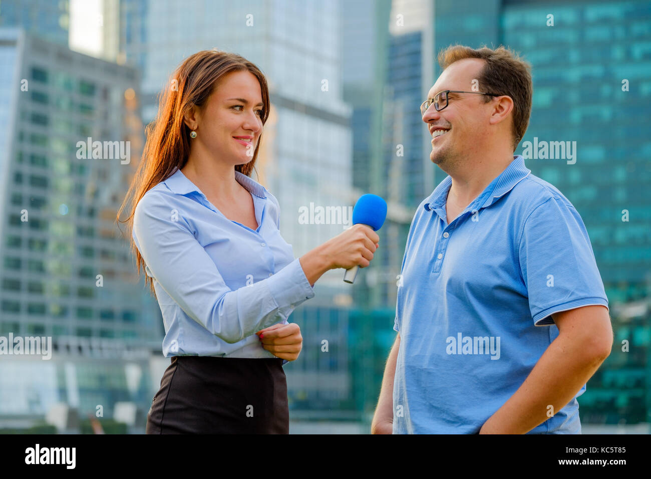 Young girl TV reporter is broadcasting Stock Photo - Alamy