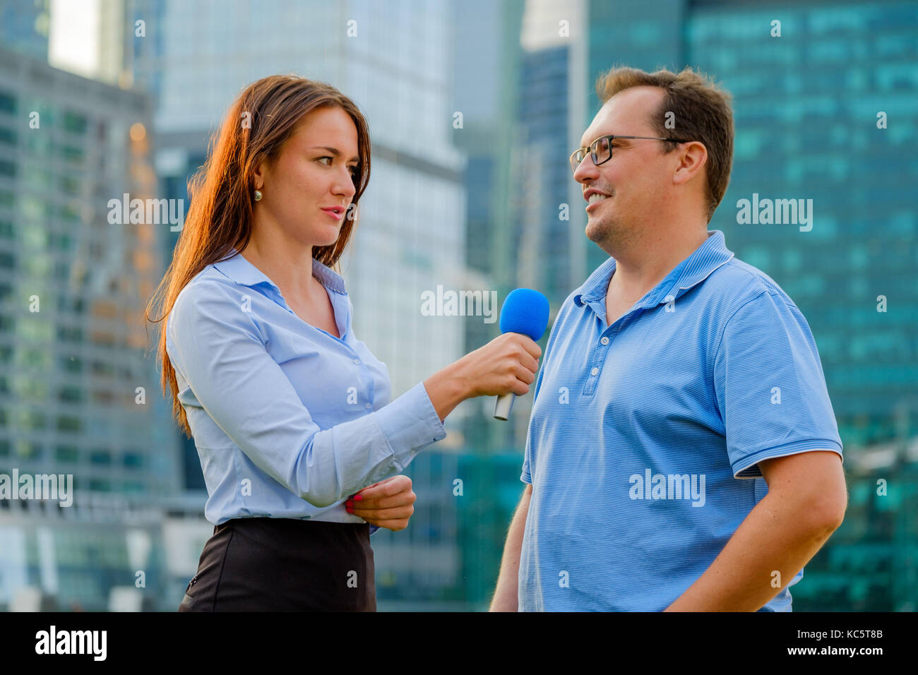 Young girl TV reporter is broadcasting Stock Photo - Alamy
