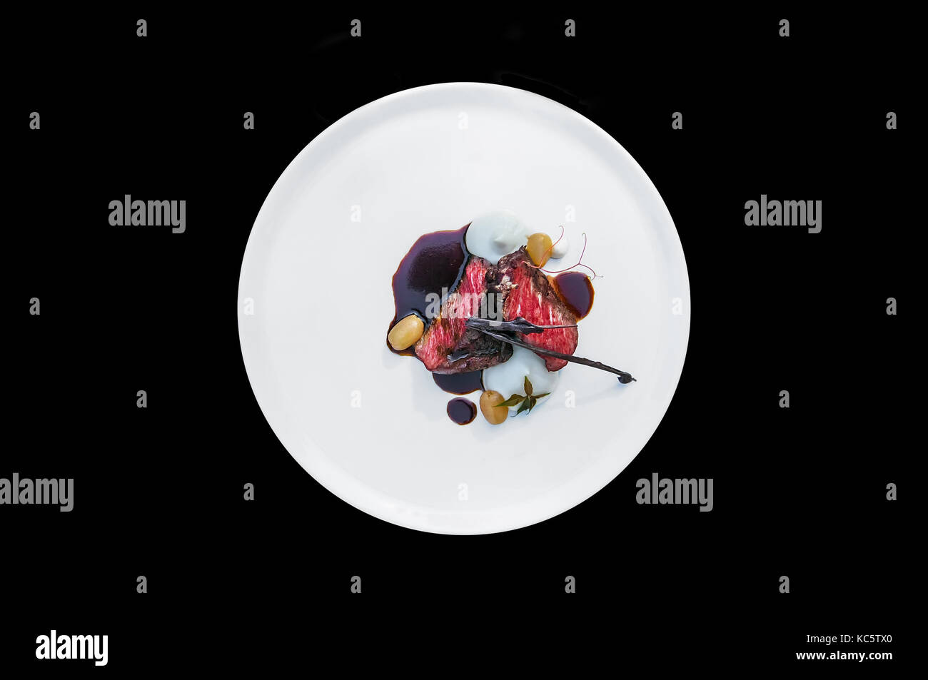 Poorly-done piece of meat under the red, white, sweet sour tomato sauce ...