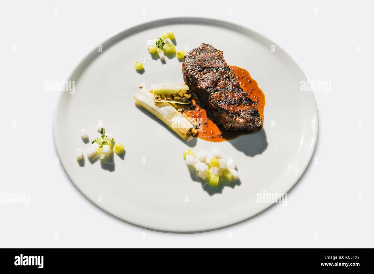 meat table : grilled beef fillet served on white plate isolated over ...