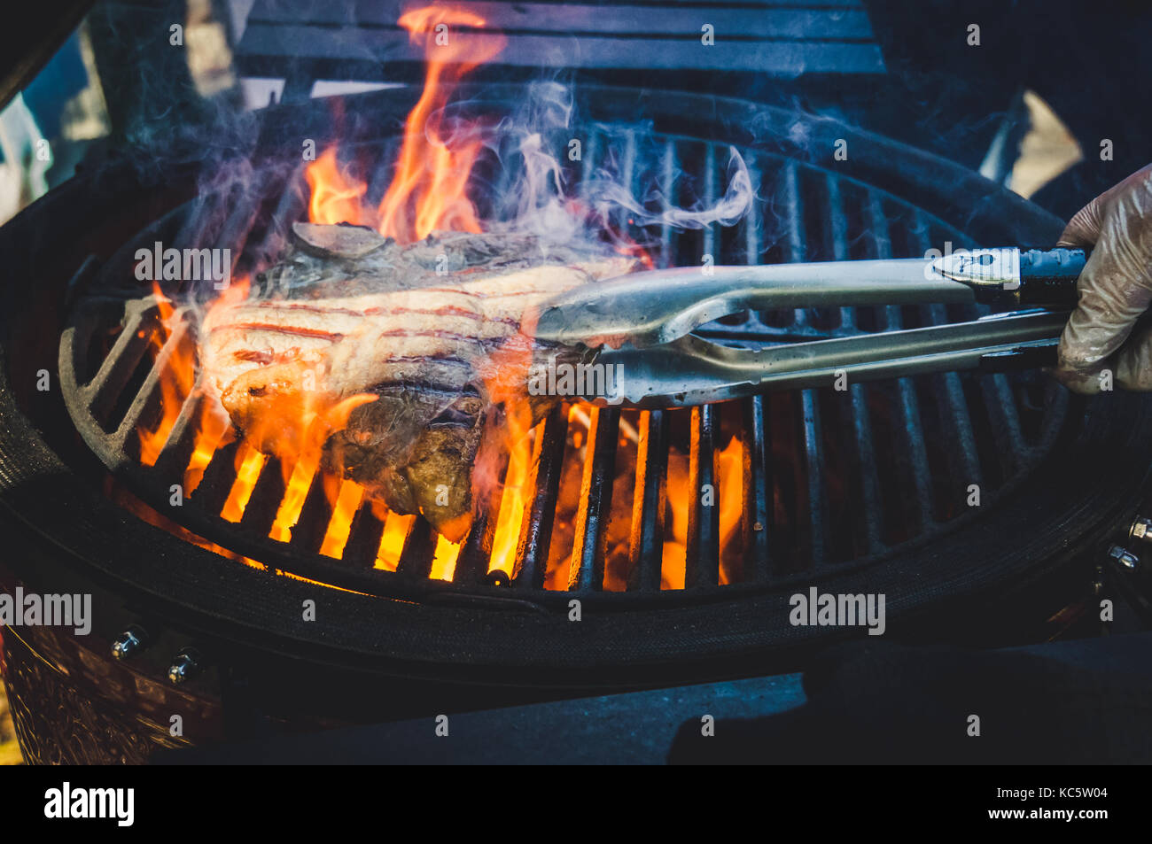Flips the meat hi-res stock photography and images - Alamy