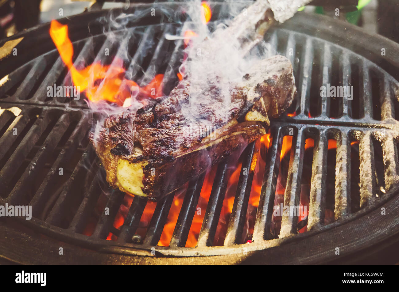 A big piece of meat marbled beef on fire. Flank Steak On Grill Stock ...