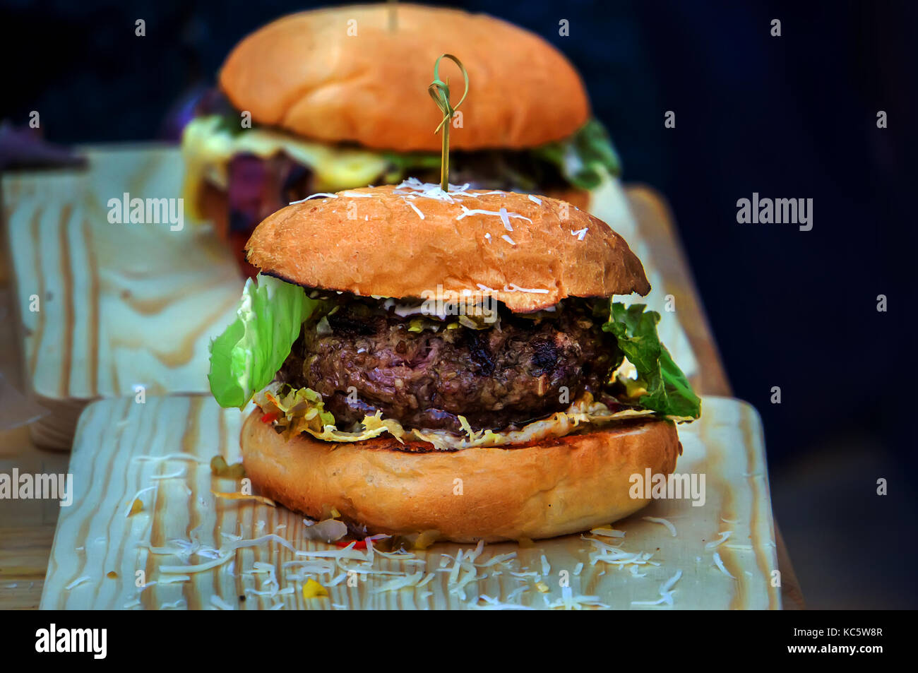 Home made hamburger with lettuce, cheese, beef meat and french fries ...