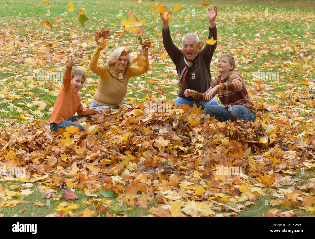elderly couple and kids having fun Stock Photo - Alamy